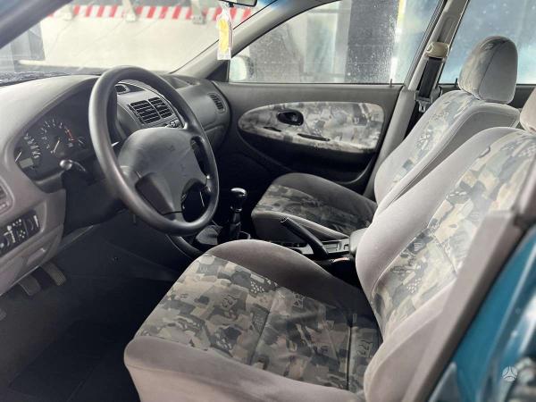Green Mitsubishi Carisma 1998 in Vilnius, with an engine capacity of 1.60 L and mileage of 123 thousand km for 1290 €, photo 11 on AUTOMOTO.COM.LV