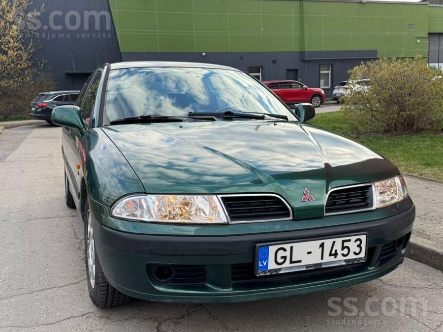 Green Mitsubishi Carisma 1999 in Riga, with an engine capacity of 1.80 L and mileage of 260 thousand km for 1450 €, photo 1 on AUTOMOTO.COM.LV