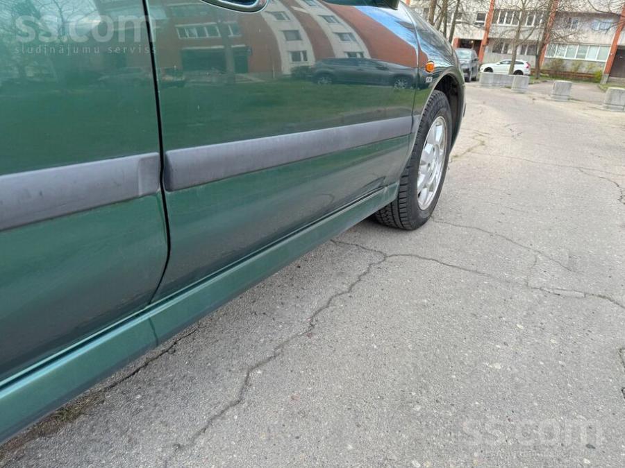 Green Mitsubishi Carisma 1999 in Riga, with an engine capacity of 1.80 L and mileage of 260 thousand km for 1450 €, photo 7 on AUTOMOTO.COM.LV