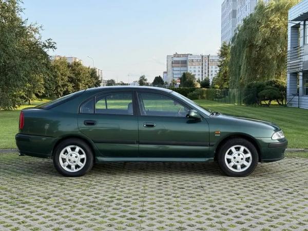 Green Mitsubishi Carisma 1999 in Riga, with an engine capacity of 1.80 L and mileage of 259 thousand km for 800 €, photo 6 on AUTOMOTO.COM.LV