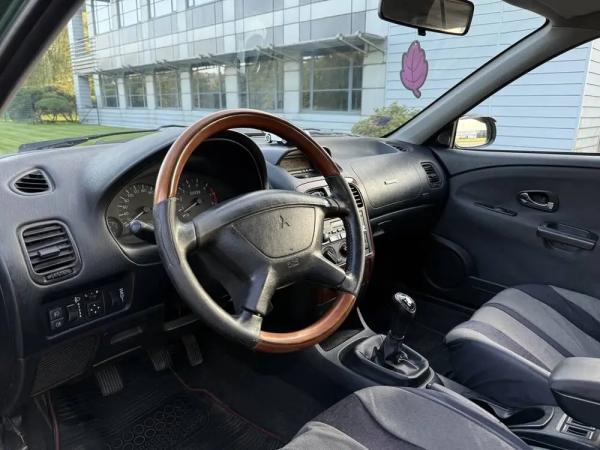 Green Mitsubishi Carisma 1999 in Riga, with an engine capacity of 1.80 L and mileage of 259 thousand km for 800 €, photo 10 on AUTOMOTO.COM.LV