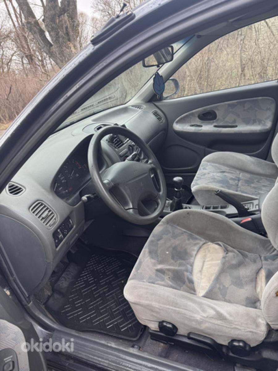Mitsubishi Carisma 1995 Kunda, ar dzinēja tilpumu 1.60 L un nobraukumu 207 tūkst. km par 500 €, foto 10 vietnē AUTOMOTO.COM.LV