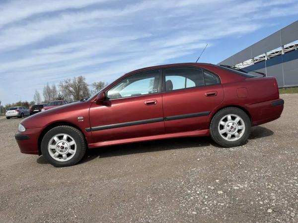 Red Mitsubishi Carisma 2000 in Daugavpils, with an engine capacity of 1.80 L and mileage of 245 thousand km for 1450 €, photo 2 on AUTOMOTO.COM.LV