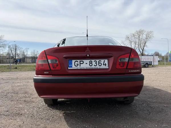 Red Mitsubishi Carisma 2000 in Daugavpils, with an engine capacity of 1.80 L and mileage of 245 thousand km for 1450 €, photo 4 on AUTOMOTO.COM.LV