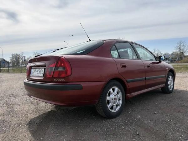 Red Mitsubishi Carisma 2000 in Daugavpils, with an engine capacity of 1.80 L and mileage of 245 thousand km for 1450 €, photo 5 on AUTOMOTO.COM.LV