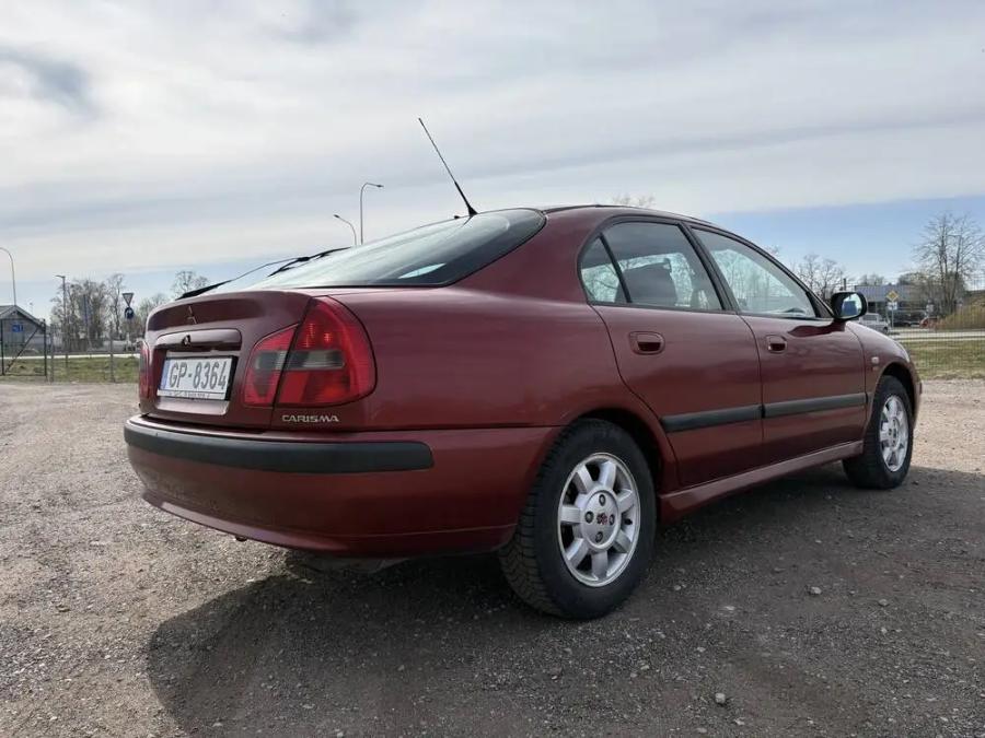 Red Mitsubishi Carisma 2000 in Daugavpils, with an engine capacity of 1.80 L and mileage of 245 thousand km for 1450 €, photo 6 on AUTOMOTO.COM.LV