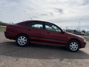 Red Mitsubishi Carisma 2000 in Daugavpils, with an engine capacity of 1.80 L and mileage of 245 thousand km for 1450 €, photo 7 on AUTOMOTO.COM.LV