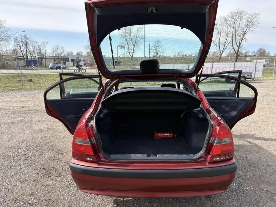Red Mitsubishi Carisma 2000 in Daugavpils, with an engine capacity of 1.80 L and mileage of 245 thousand km for 1450 €, photo 24 on AUTOMOTO.COM.LV