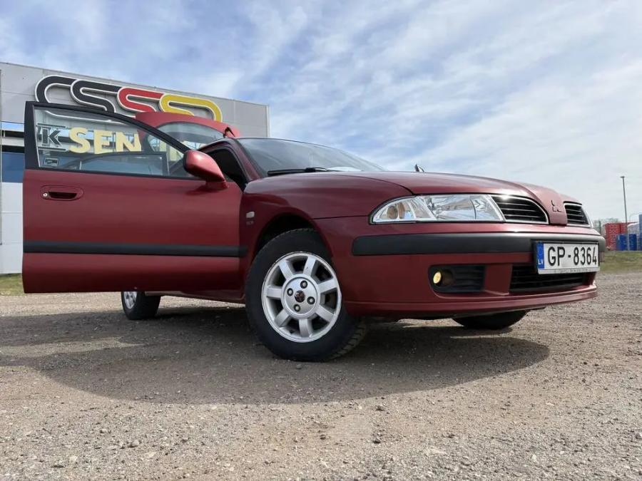 Red Mitsubishi Carisma 2000 in Daugavpils, with an engine capacity of 1.80 L and mileage of 245 thousand km for 1450 €, photo 31 on AUTOMOTO.COM.LV