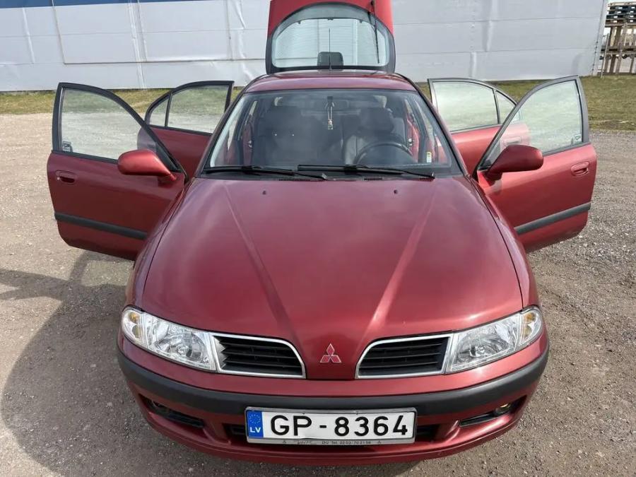 Red Mitsubishi Carisma 2000 in Daugavpils, with an engine capacity of 1.80 L and mileage of 245 thousand km for 1450 €, photo 32 on AUTOMOTO.COM.LV