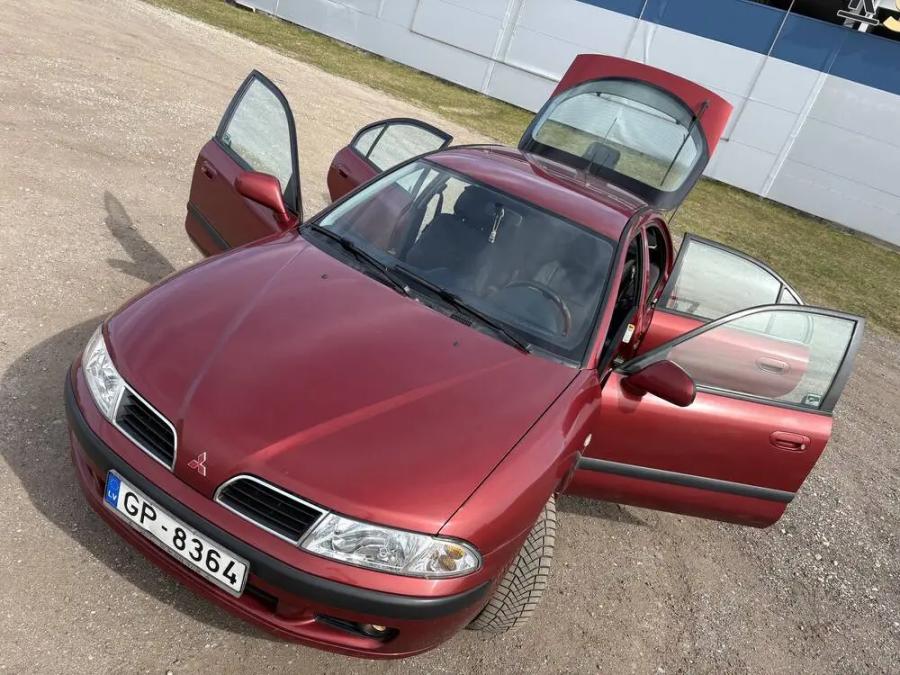 Red Mitsubishi Carisma 2000 in Daugavpils, with an engine capacity of 1.80 L and mileage of 245 thousand km for 1450 €, photo 33 on AUTOMOTO.COM.LV