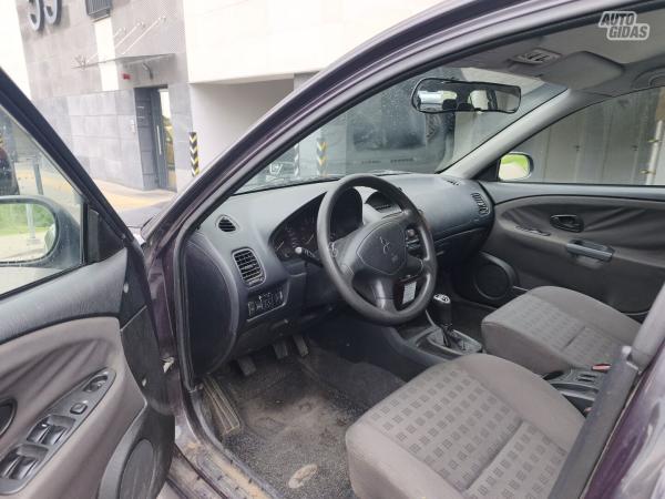 Mitsubishi Carisma 2001 in Vilnius, with an engine capacity of 1.90 L and mileage of 139 thousand km for 650 €, photo 9 on AUTOMOTO.COM.LV