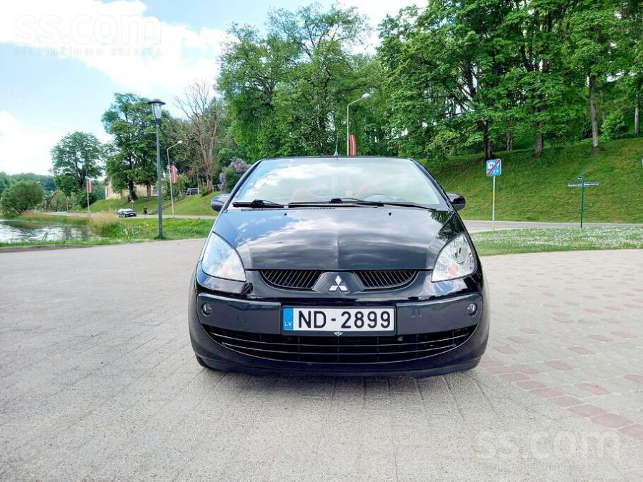 Black Mitsubishi Colt 2008 in Riga, with an engine capacity of 1.50 L and mileage of 130 thousand km for 1450 €, photo 3 on AUTOMOTO.COM.LV