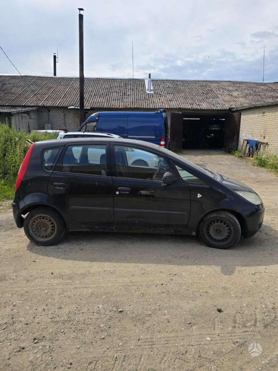 Black Mitsubishi Colt 2004 in Kupiskis, with an engine capacity of 1.30 L and mileage of 325 thousand km for 650 €, photo 5 on AUTOMOTO.COM.LV