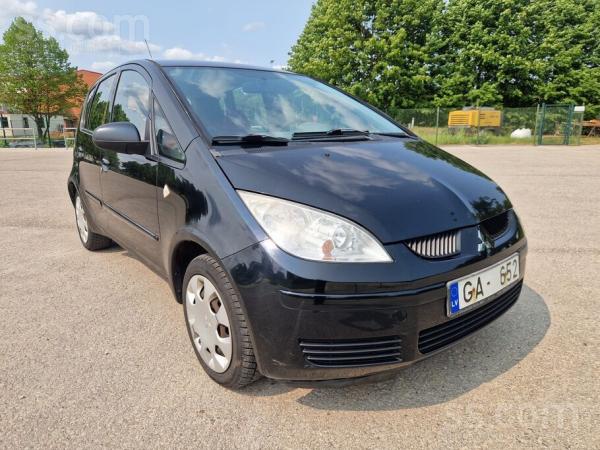 Black Mitsubishi Colt 2006 in Riga, with an engine capacity of 1.30 L and mileage of 174 thousand km for 950 €, photo 2 on AUTOMOTO.COM.LV