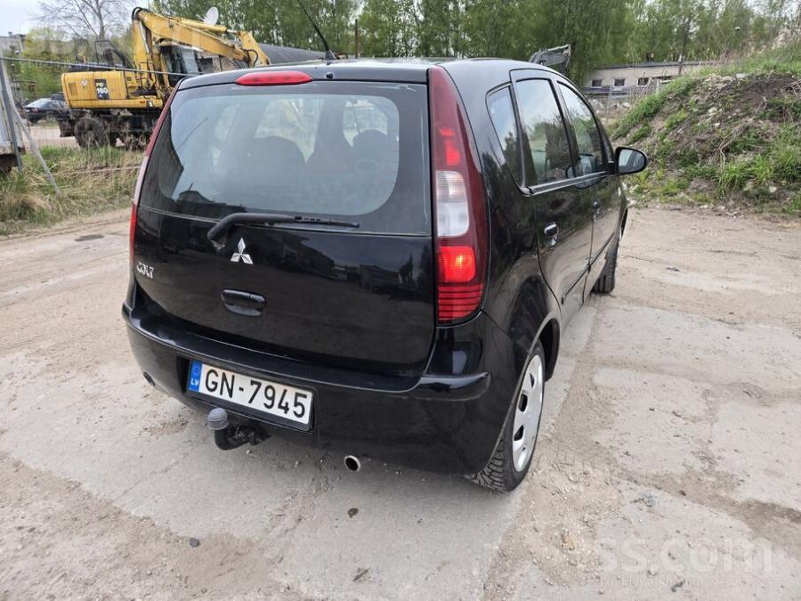 Black Mitsubishi Colt 2007 in Riga, with an engine capacity of 1.30 L and mileage of 326 thousand km for 700 €, photo 4 on AUTOMOTO.COM.LV