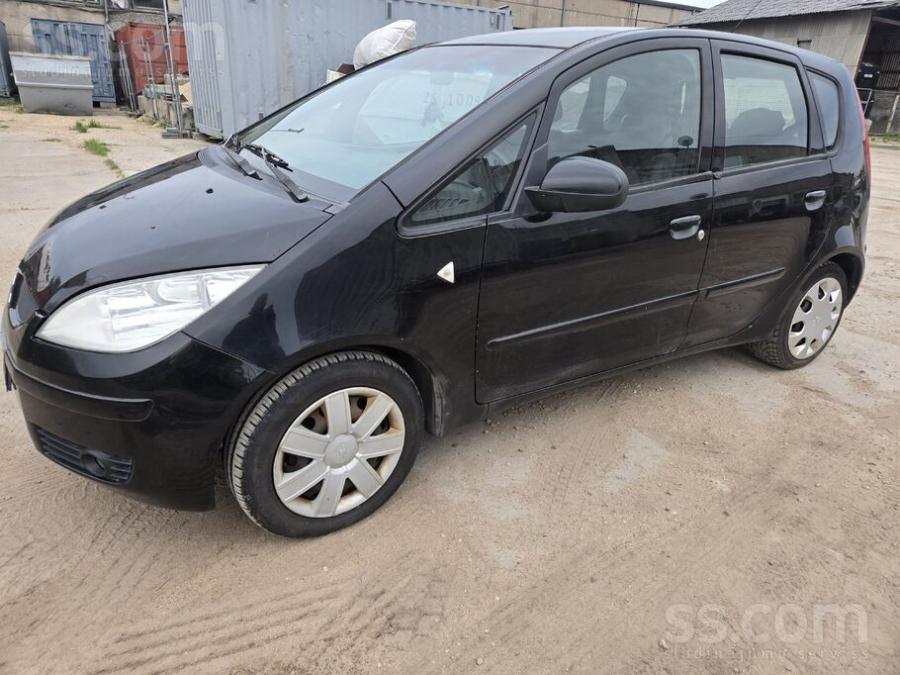 Black Mitsubishi Colt 2007 in Riga, with an engine capacity of 1.30 L and mileage of 326 thousand km for 700 €, photo 6 on AUTOMOTO.COM.LV