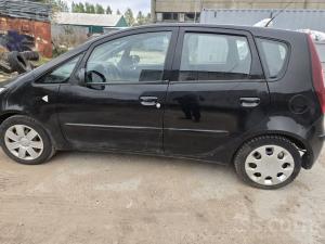 Black Mitsubishi Colt 2007 in Riga, with an engine capacity of 1.30 L and mileage of 326 thousand km for 700 €, photo 7 on AUTOMOTO.COM.LV