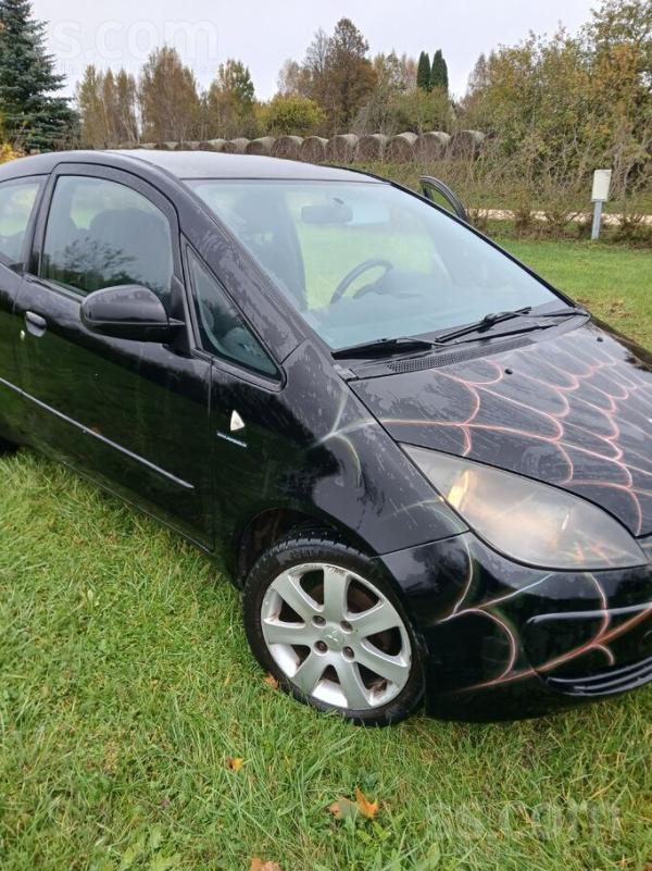 Black Mitsubishi Colt 2007 in Riga, with an engine capacity of 1.30 L and mileage of 227 thousand km for 1100 €, photo 3 on AUTOMOTO.COM.LV