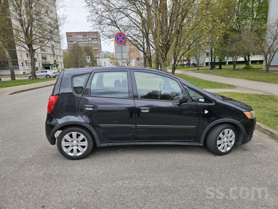 Black Mitsubishi Colt 2011 in Riga, with an engine capacity of 1.30 L and mileage of 136 thousand km for 2850 €, photo 8 on AUTOMOTO.COM.LV