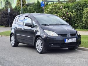 Black Mitsubishi Colt 2011 in Riga, with an engine capacity of 1.50 L and mileage of 206 thousand km for 2700 €, photo  on AUTOMOTO.COM.LV