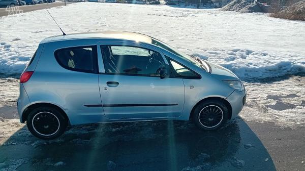 Blue Mitsubishi Colt 2006 in Kaunas, with an engine capacity of 1.10 L and mileage of 202 thousand km for 550 €, photo 8 on AUTOMOTO.COM.LV
