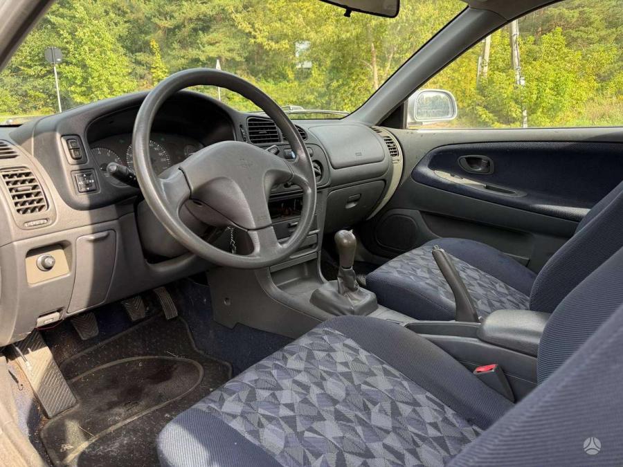 Pelēks Mitsubishi Colt 1997 Viļņa, ar dzinēja tilpumu 1.30 L un nobraukumu 168 tūkst. km par 999 €, foto 12 vietnē AUTOMOTO.COM.LV
