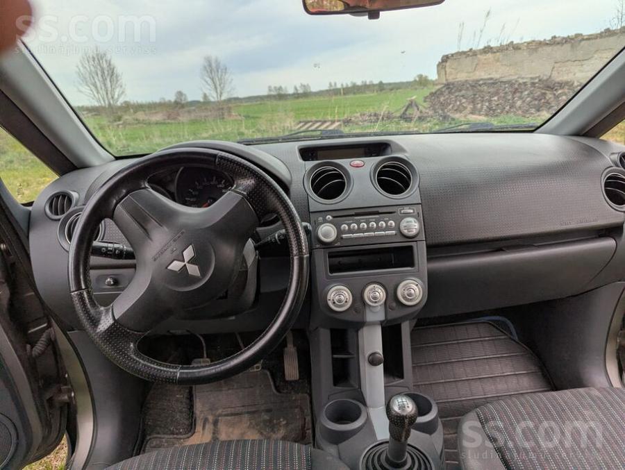 Grey Mitsubishi Colt 2007 in Riga, with an engine capacity of 1.30 L and mileage of 239 thousand km for 170 €, photo 4 on AUTOMOTO.COM.LV
