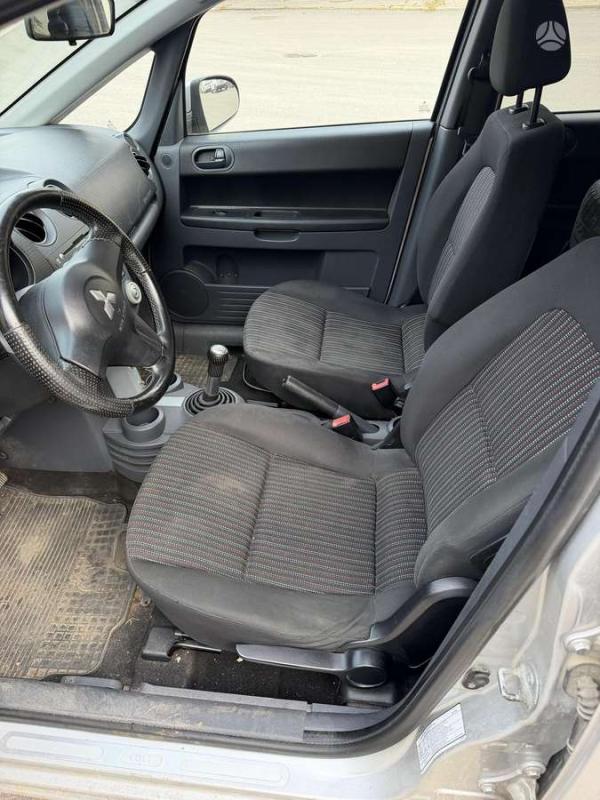 Grey Mitsubishi Colt 2007 in Vilnius, with an engine capacity of 1.49 L and mileage of 218 thousand km for 550 €, photo 8 on AUTOMOTO.COM.LV