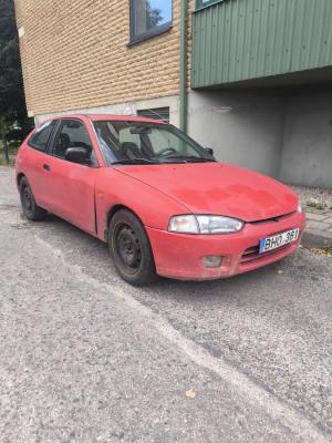 Sarkans Mitsubishi Colt 1997 Viļņa, ar dzinēja tilpumu 1.30 L un nobraukumu 239 tūkst. km par 650 €, foto 3 vietnē AUTOMOTO.COM.LV