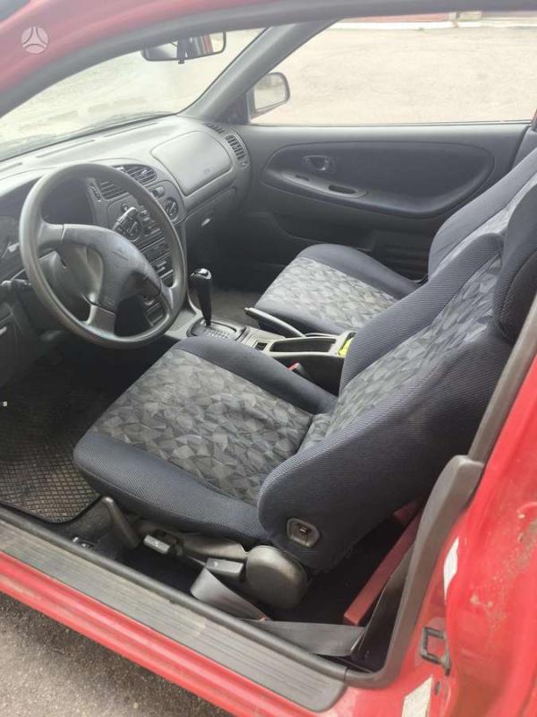 Red Mitsubishi Colt 1997 in Vilnius, with an engine capacity of 1.30 L and mileage of 239 thousand km for 650 €, photo 5 on AUTOMOTO.COM.LV