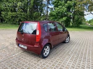 Red Mitsubishi Colt 2006 in Cesis, with an engine capacity of 1.30 L and mileage of 198 thousand km for 1250 €, photo 7 on AUTOMOTO.COM.LV