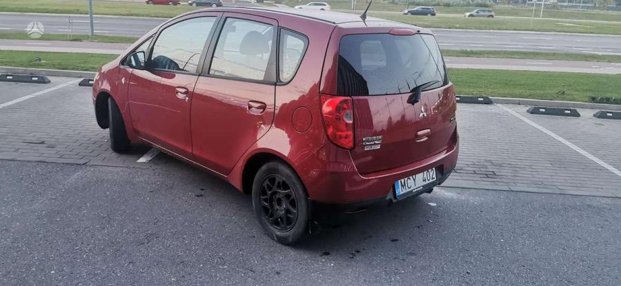 Red Mitsubishi Colt 2010 in Vilnius, with an engine capacity of 1.12 L and mileage of 241 thousand km for 1750 €, photo 5 on AUTOMOTO.COM.LV
