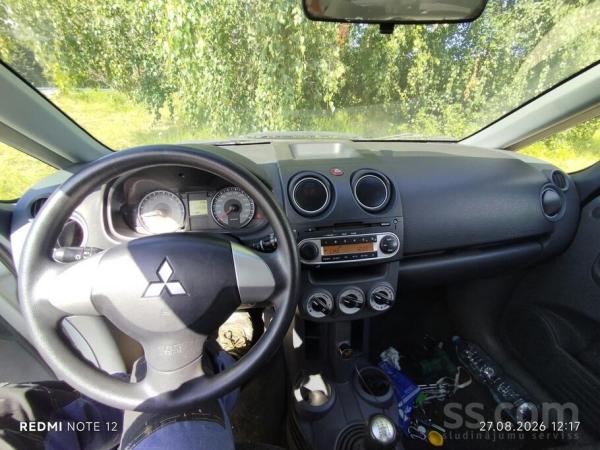 Белый Мицубиси Кольт 2012 в Рига, объемом двигателя 1.10 л и пробегом 64 тыс. км за 2400 €, фото 1 на AUTOMOTO.COM.LV