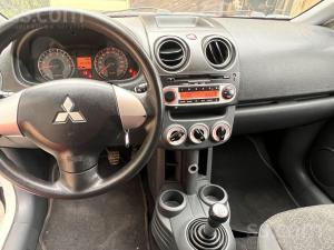 White Mitsubishi Colt 2010 in Riga, with an engine capacity of 1.30 L and mileage of 201 thousand km for 2750 €, photo 13 on AUTOMOTO.COM.LV