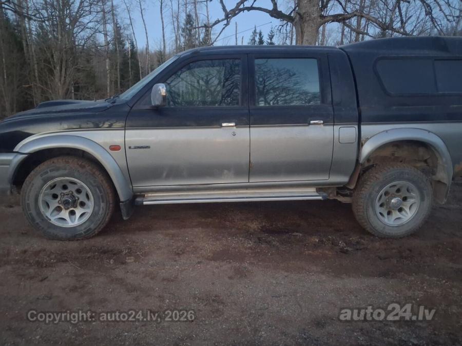 Black Mitsubishi l-200 2000 in Tallinn, with an engine capacity of 2.50 L and mileage of 299 thousand km for 4000 €, photo 3 on AUTOMOTO.COM.LV