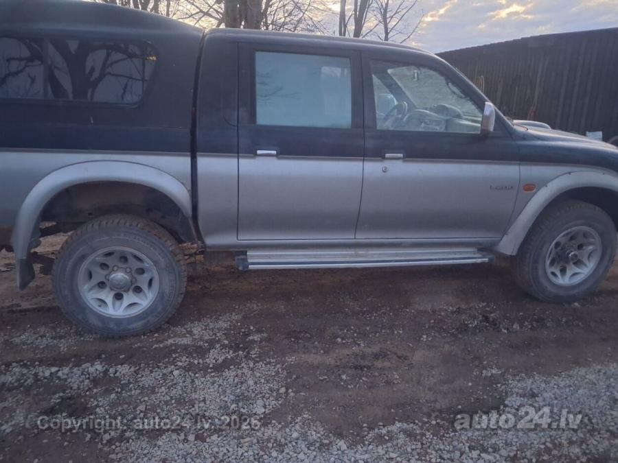 Black Mitsubishi l-200 2000 in Tallinn, with an engine capacity of 2.50 L and mileage of 299 thousand km for 4000 €, photo 4 on AUTOMOTO.COM.LV