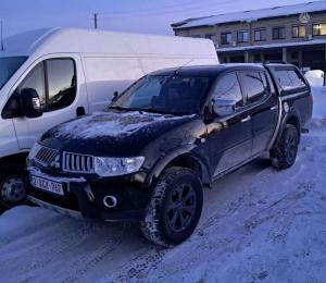 Black Mitsubishi l-200 2011 in Vilnius, with an engine capacity of 2.50 L and mileage of 245 thousand km for 9990 €, photo 19 on AUTOMOTO.COM.LV