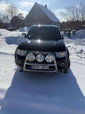 Black Mitsubishi l-200 2011 in Vilnius, with an engine capacity of 0.00 L and mileage of 330 thousand km for 12700 €, photo  on AUTOMOTO.COM.LV
