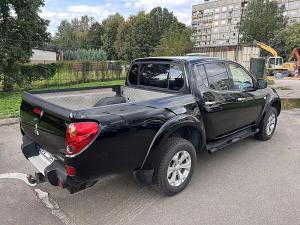 Black Mitsubishi l-200 2011 in Riga, with an engine capacity of 2.50 L and mileage of 159 thousand km for 10950 €, photo 5 on AUTOMOTO.COM.LV