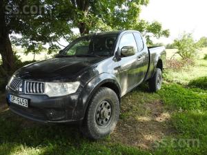 Black Mitsubishi l-200 2012 in Ogre, with an engine capacity of 2.50 L and mileage of 265 thousand km for 6300 €, photo  on AUTOMOTO.COM.LV