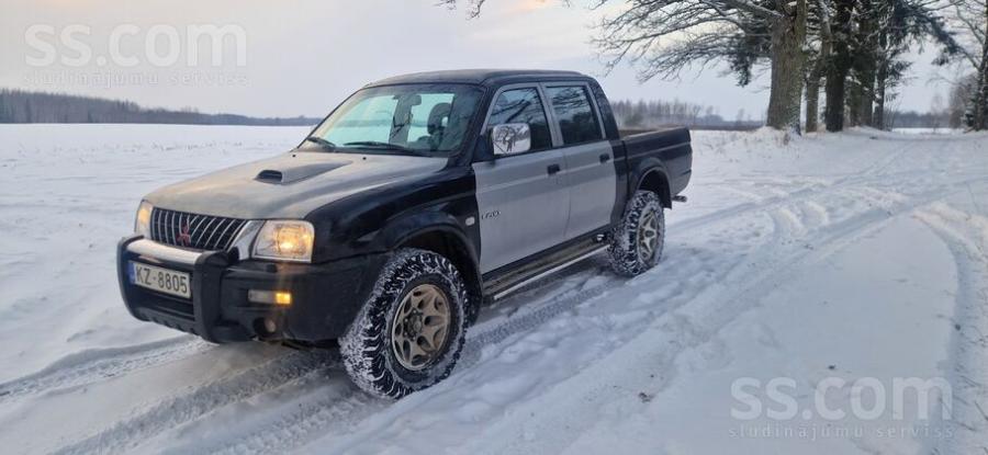Melns Mitsubishi l-200 2001 Ogre, ar dzinēja tilpumu 2.50 L un nobraukumu 157 tūkst. km par 7250 €, foto 1 vietnē AUTOMOTO.COM.LV