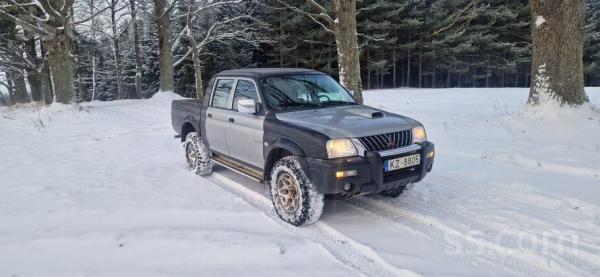 Melns Mitsubishi l-200 2001 Ogre, ar dzinēja tilpumu 2.50 L un nobraukumu 157 tūkst. km par 7250 €, foto 2 vietnē AUTOMOTO.COM.LV