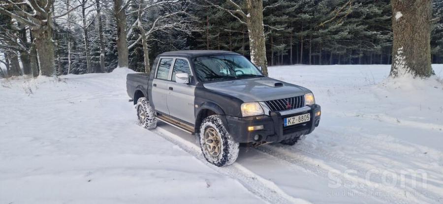 Melns Mitsubishi l-200 2001 Ogre, ar dzinēja tilpumu 2.50 L un nobraukumu 157 tūkst. km par 7250 €, foto 2 vietnē AUTOMOTO.COM.LV