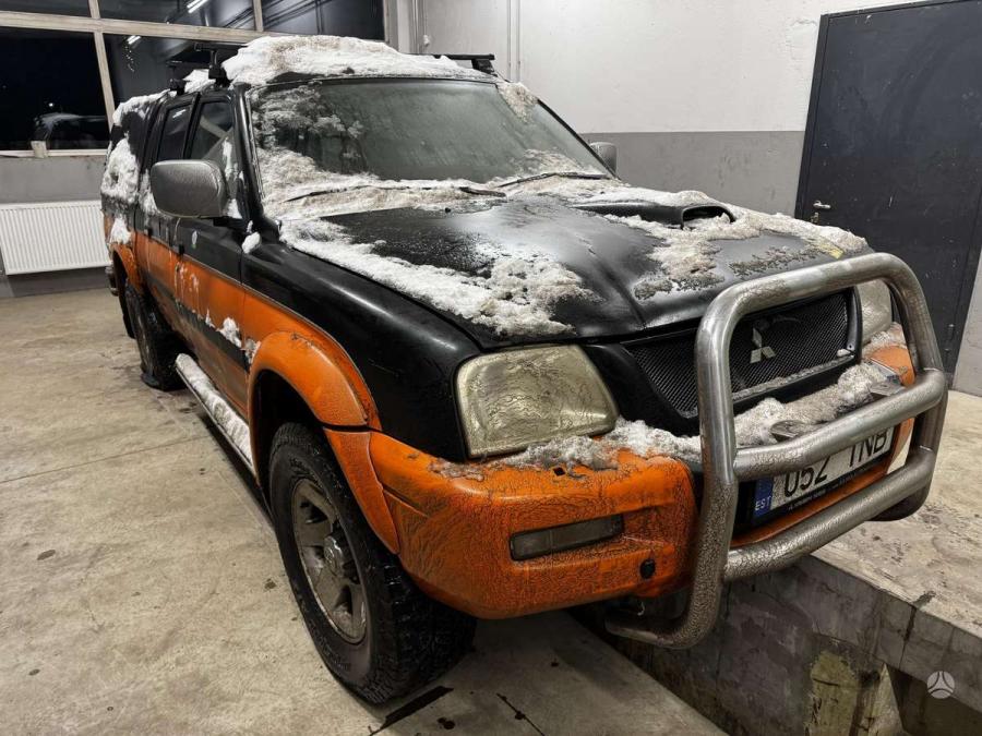 Melns Mitsubishi l-200 2004 Hāpsalu, ar dzinēja tilpumu 2.48 L un nobraukumu 254 tūkst. km par 4588 €, foto 1 vietnē AUTOMOTO.COM.LV