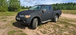 Melns Mitsubishi l-200 2006 Madona, ar dzinēja tilpumu 2.50 L un nobraukumu 470 tūkst. km par 6450 €, foto  vietnē AUTOMOTO.COM.LV