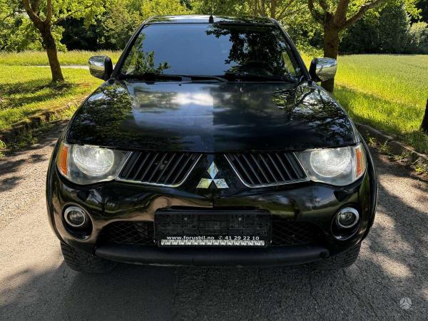Melns Mitsubishi l-200 2007 Panevēža, ar dzinēja tilpumu 2.48 L un nobraukumu 325 tūkst. km par 7500 €, foto 2 vietnē AUTOMOTO.COM.LV