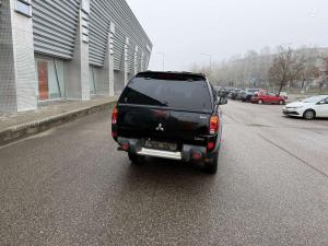 Black Mitsubishi l-200 2008 in Vilnius, with an engine capacity of 2.48 L and mileage of 284 thousand km for 6900 €, photo 5 on AUTOMOTO.COM.LV