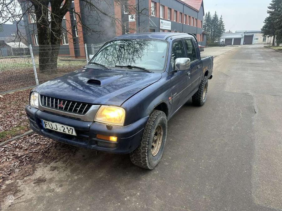 Zils Mitsubishi l-200 1998 Tauragė, ar dzinēja tilpumu 2.48 L un nobraukumu 288 tūkst. km par 2500 €, foto 1 vietnē AUTOMOTO.COM.LV