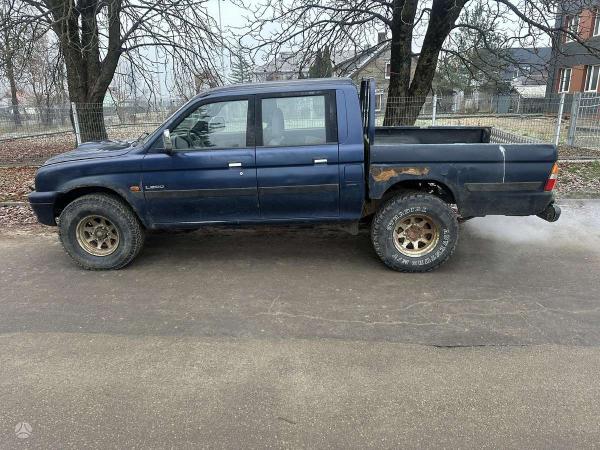 Blue Mitsubishi l-200 1998 in Taurage, with an engine capacity of 2.48 L and mileage of 288 thousand km for 2500 €, photo 4 on AUTOMOTO.COM.LV